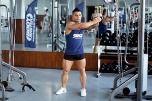 Lumberjack exercise on a block, with a kettlebell and a dumbbell ...